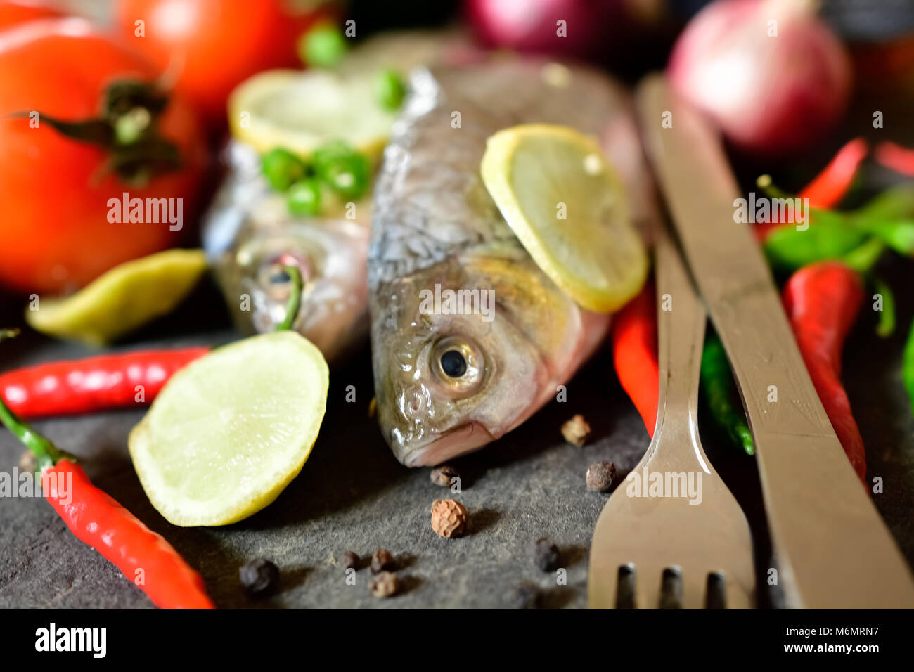 Raw freshest fish with cooking mineral on rough stone background. Raw ...