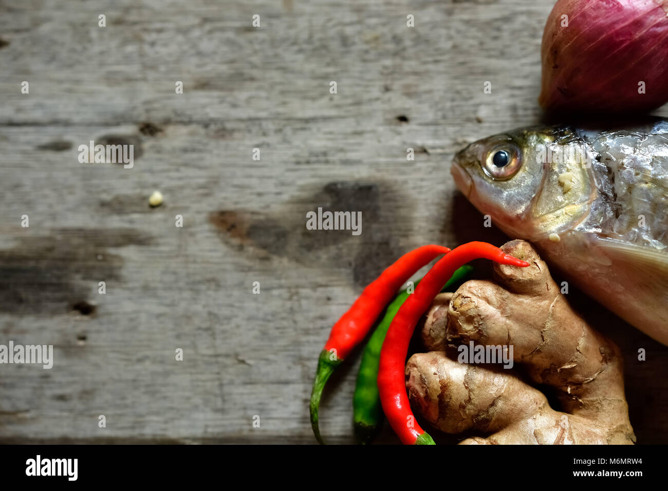 Raw freshest fish with cooking mineral on rough stone background. Tail ...