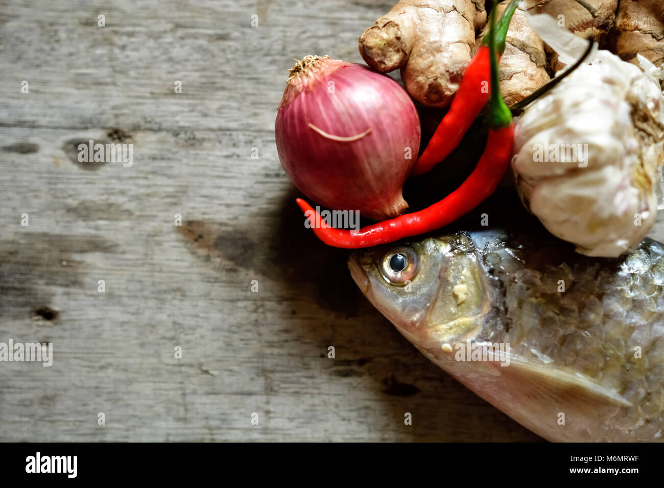 Raw freshest fish with cooking mineral on rough stone background. Tail ...