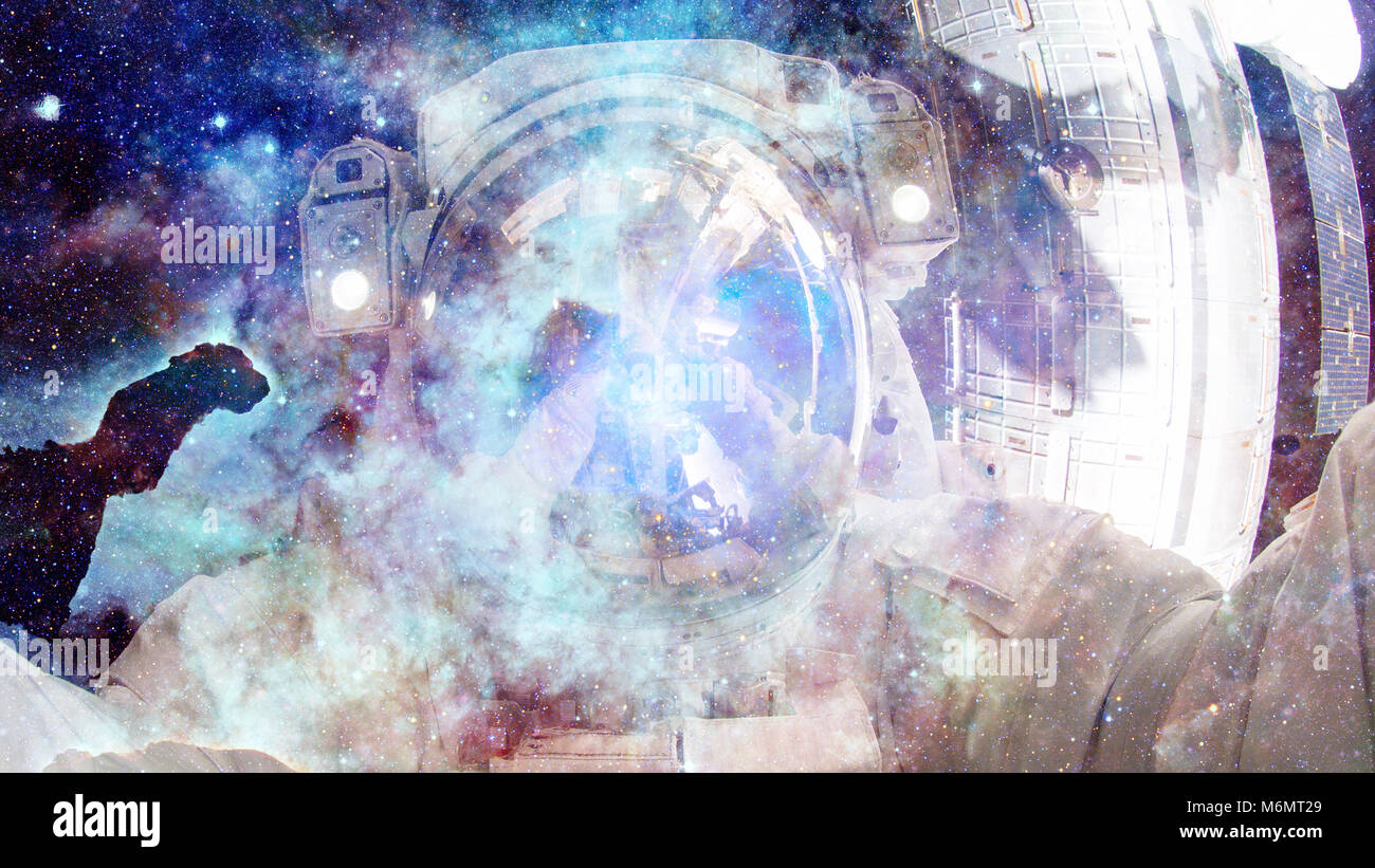 Astronaut in outer space. Science fiction art. Elements of this image ...