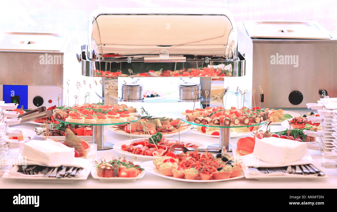 catering table set service with silverware Stock Photo - Alamy