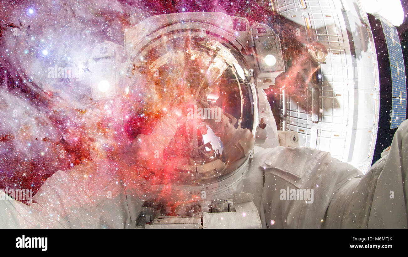 Astronaut in outer space. Science fiction art. Elements of this image ...