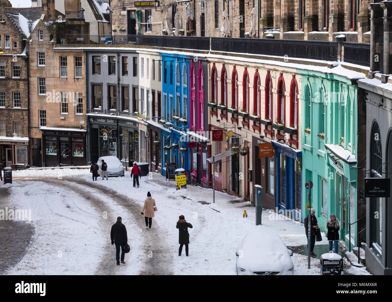 View of historic Victoria Street in Edinburgh Old Town after heavy snow ...