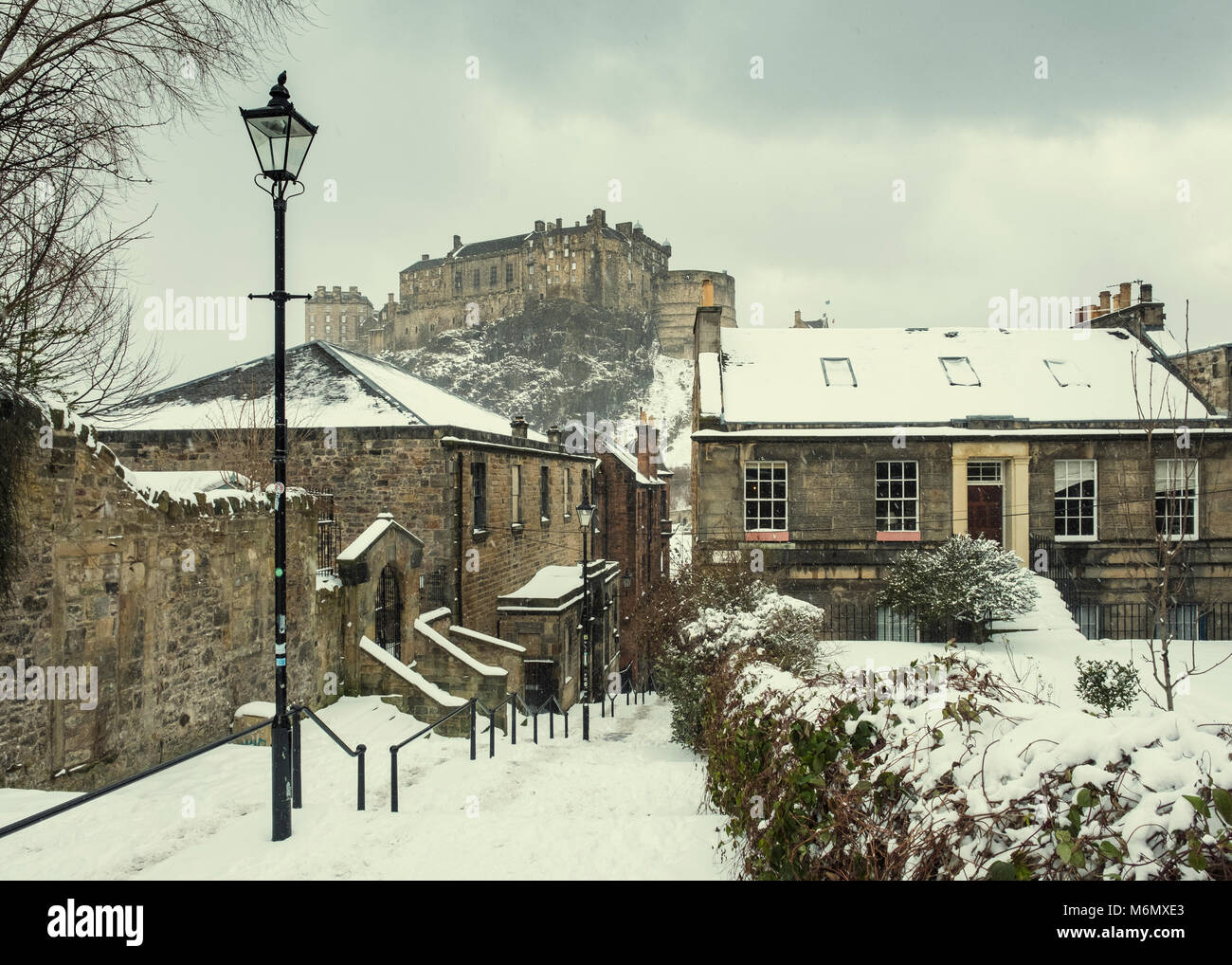 View of Edinburgh Castle after snow from the historic Vennel steps at ...