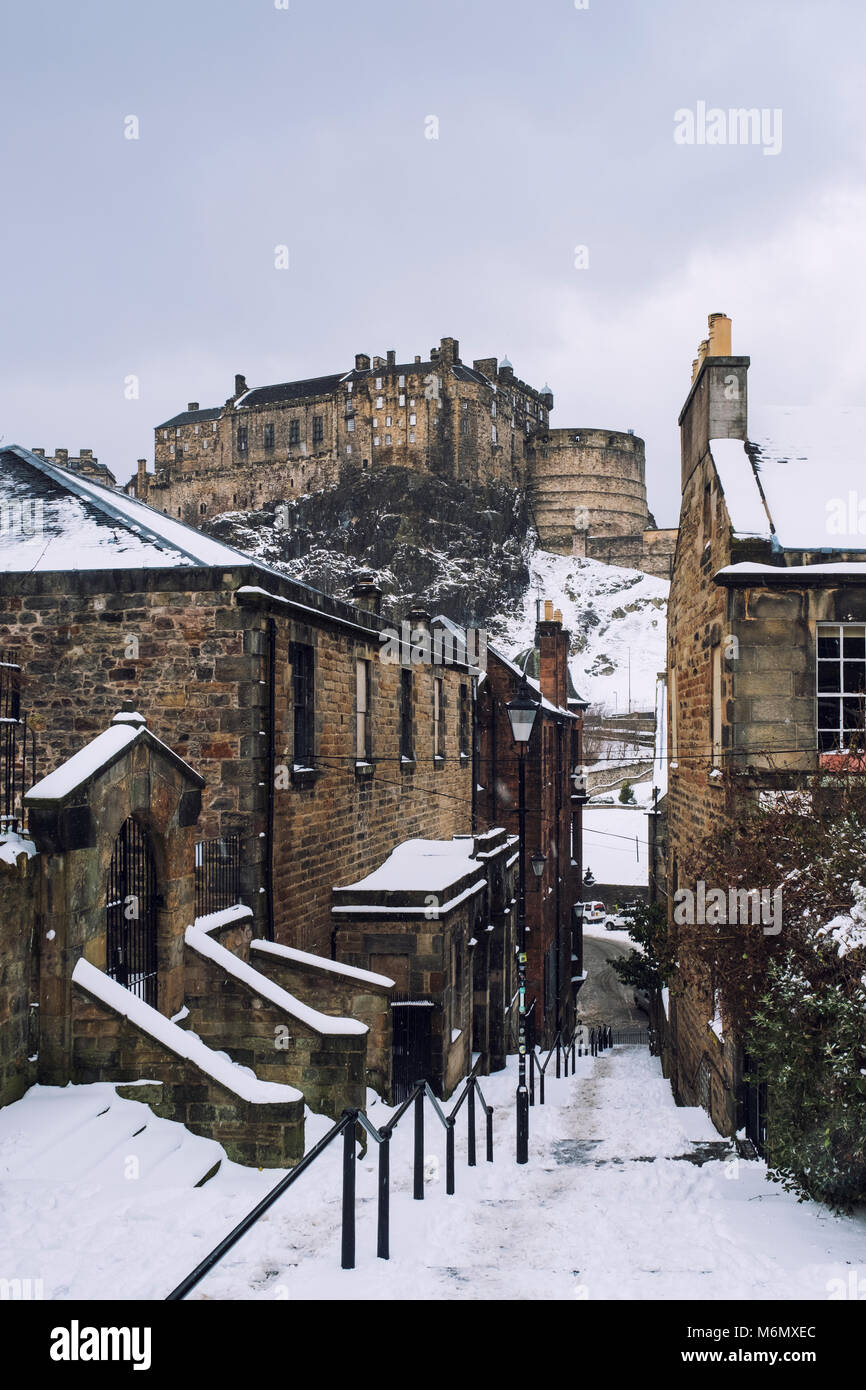 View of Edinburgh Castle after snow from the historic Vennel steps at ...