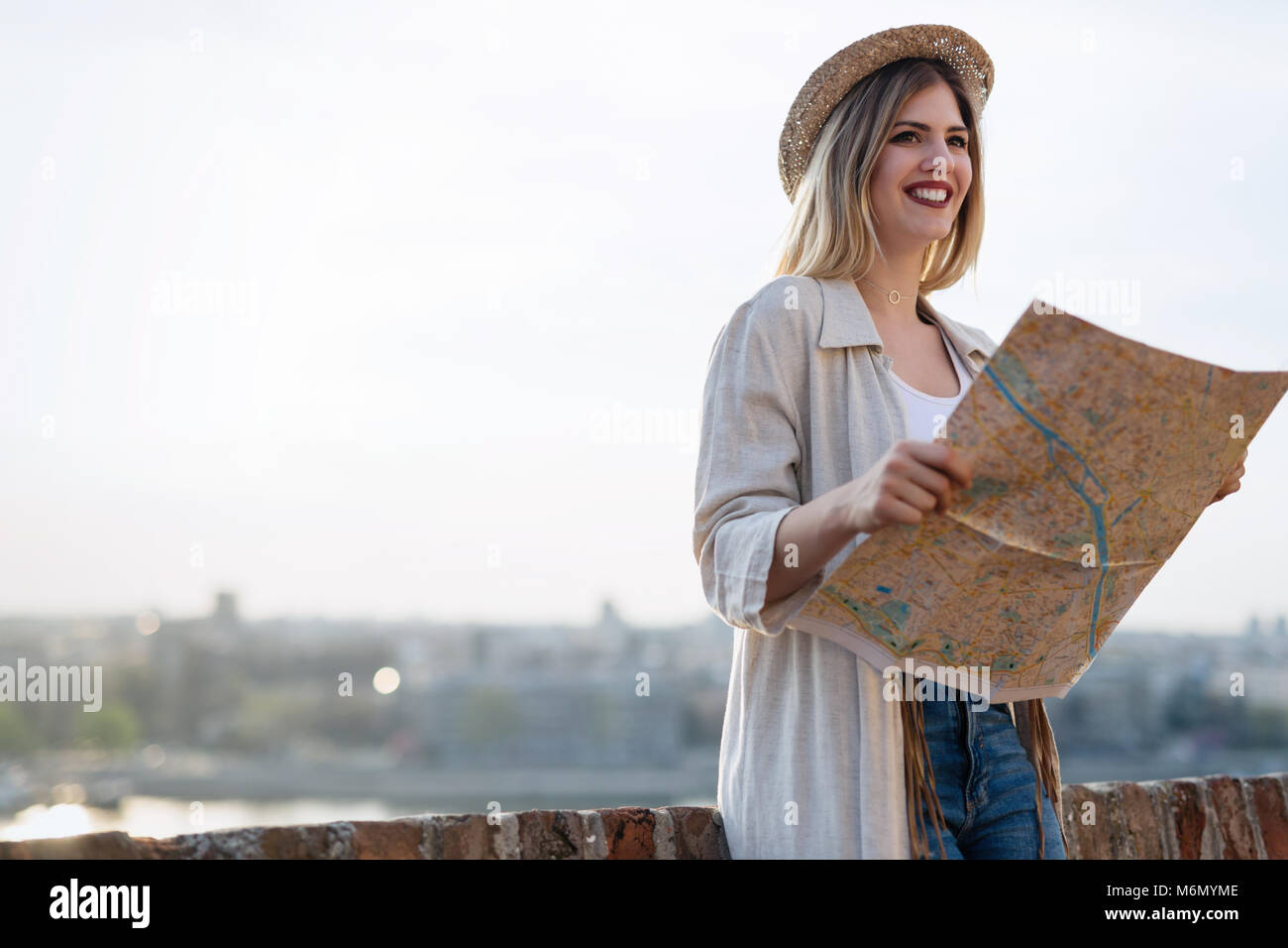 Happy female tourist sightseeing and exploring Stock Photo - Alamy