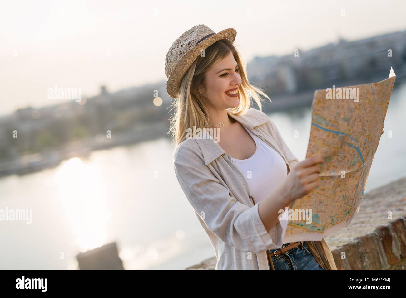 Happy female tourist sightseeing and exploring Stock Photo - Alamy