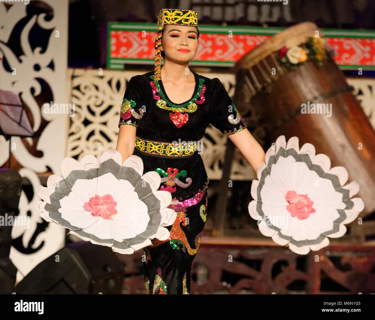 Dancers in traditional native costumes at the Sarawak Cultural Village ...