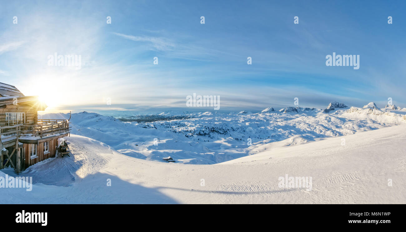Winter panoramic view in Alps with log cabin. Outdoor activities on ...