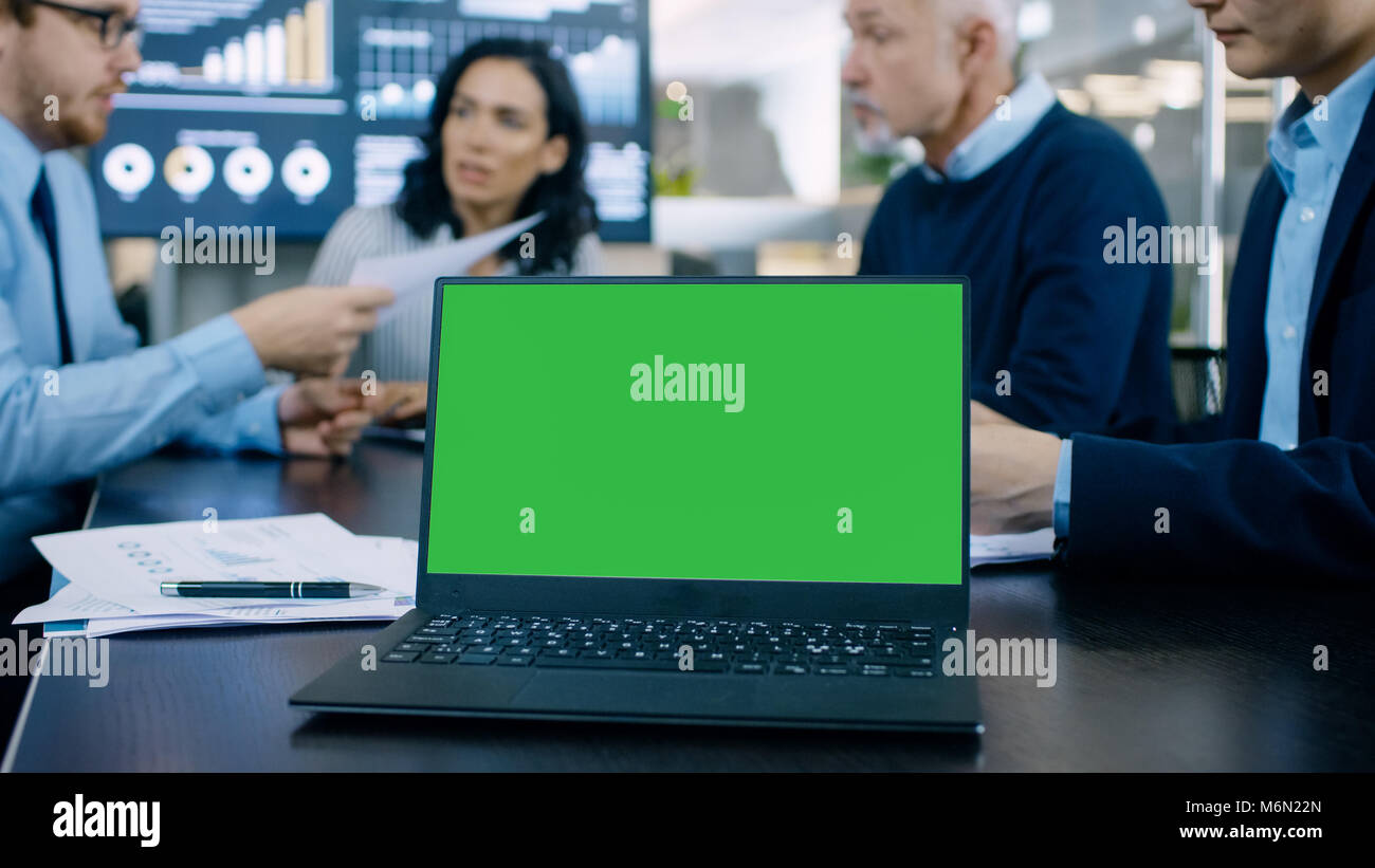 In the Meeting Room Laptop with Green Chroma Key Screen on the ...