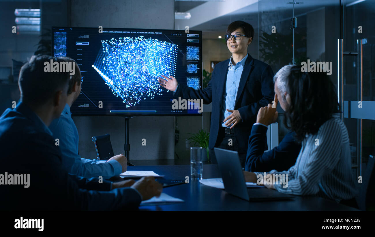 In the Conference Room Chief Engineer Presents to a Board of Scientists ...