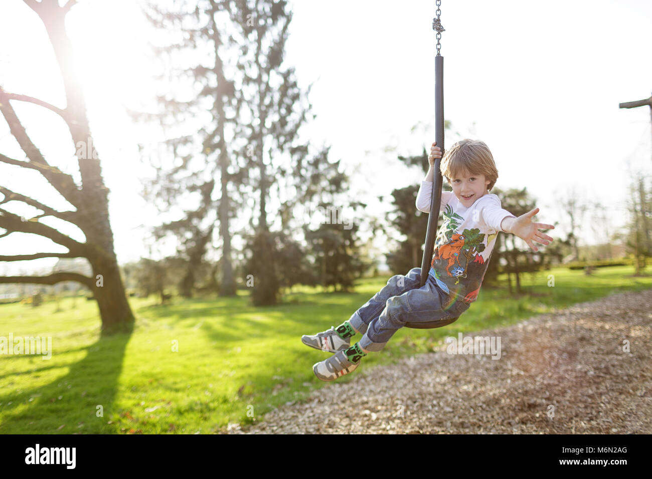 happy little boy playing in the park outdoors Stock Photo - Alamy