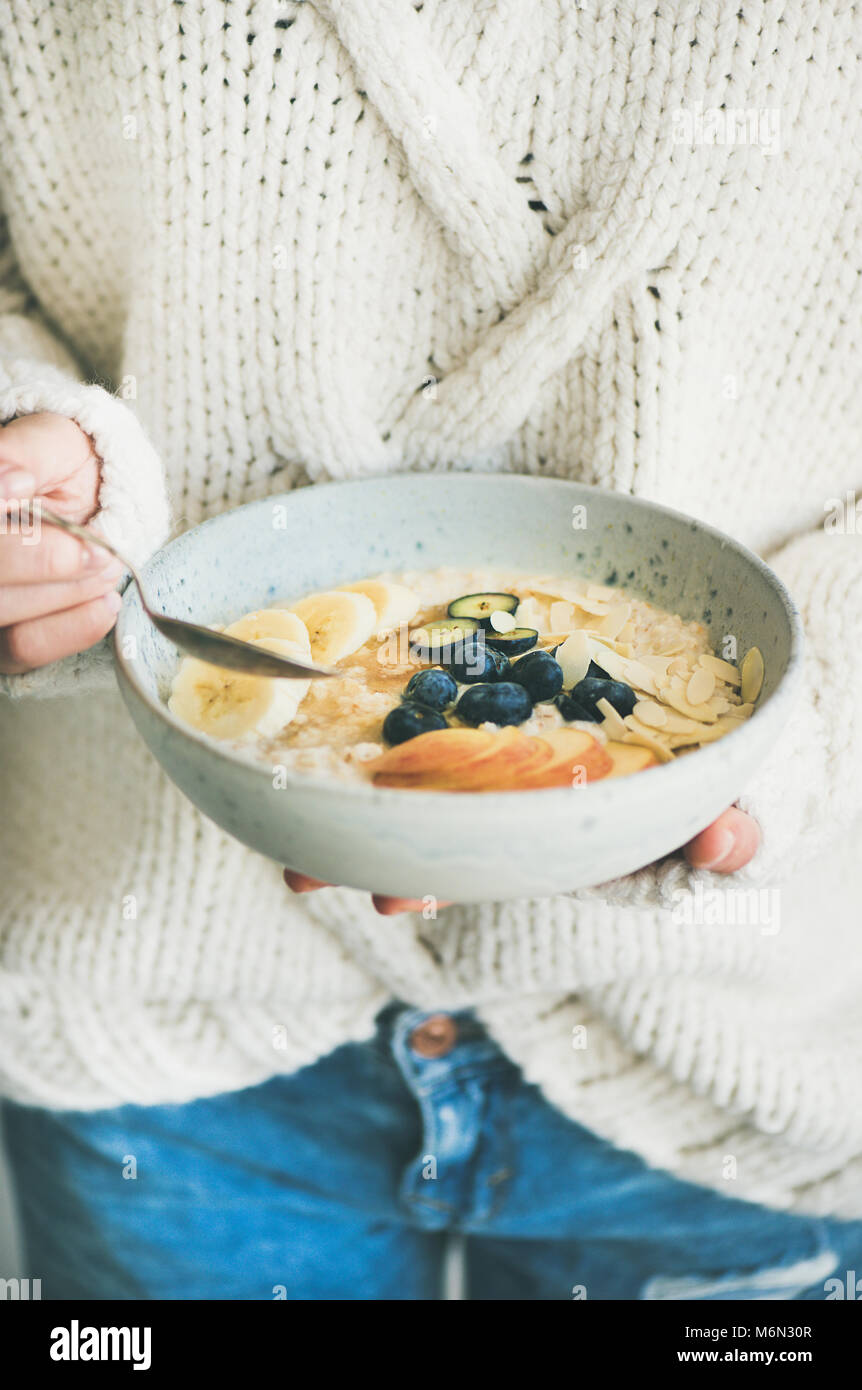 Woman eating oatmeal winter hi-res stock photography and images - Alamy
