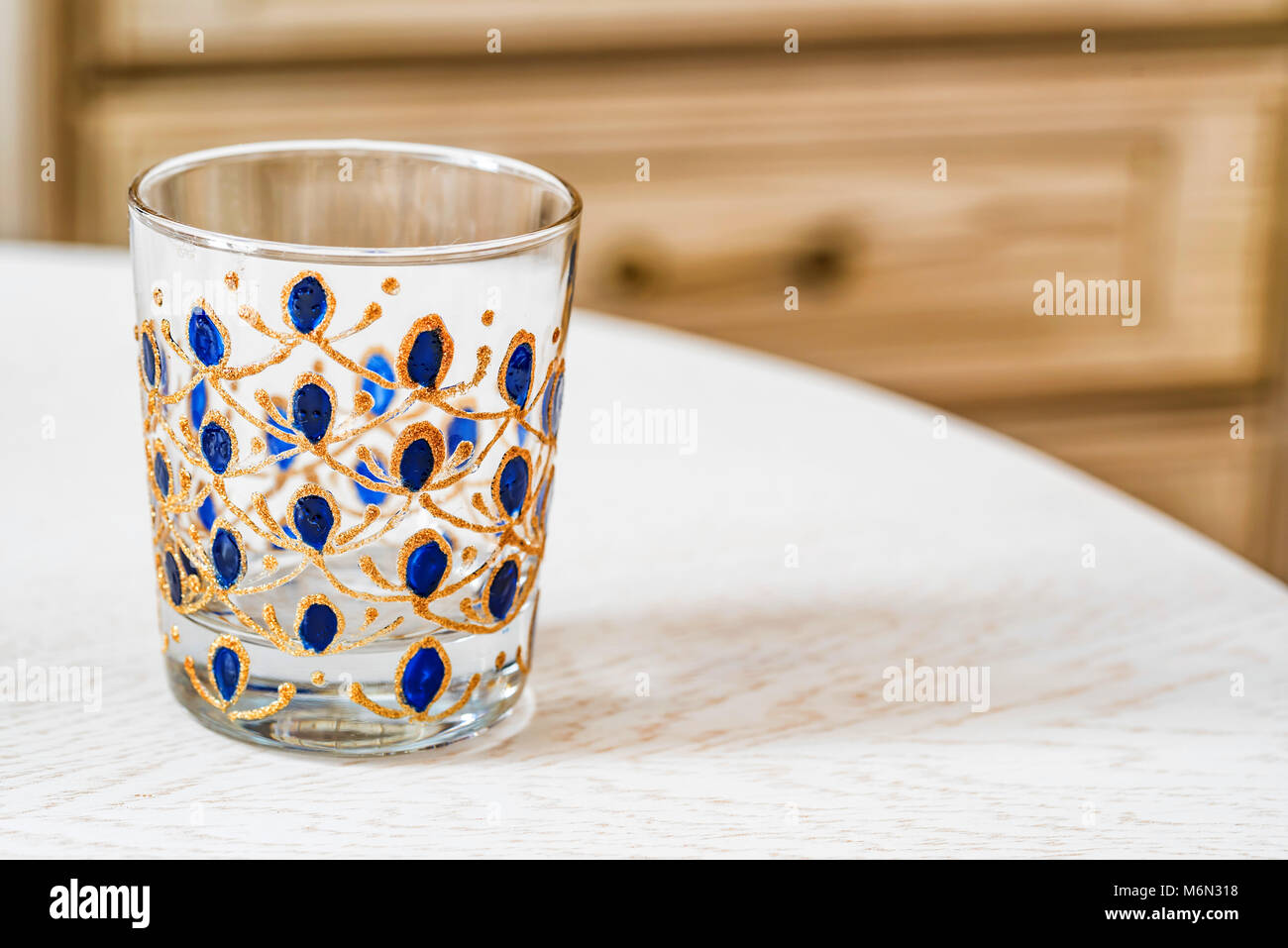 Glass with colorful hand painting Stock Photo - Alamy