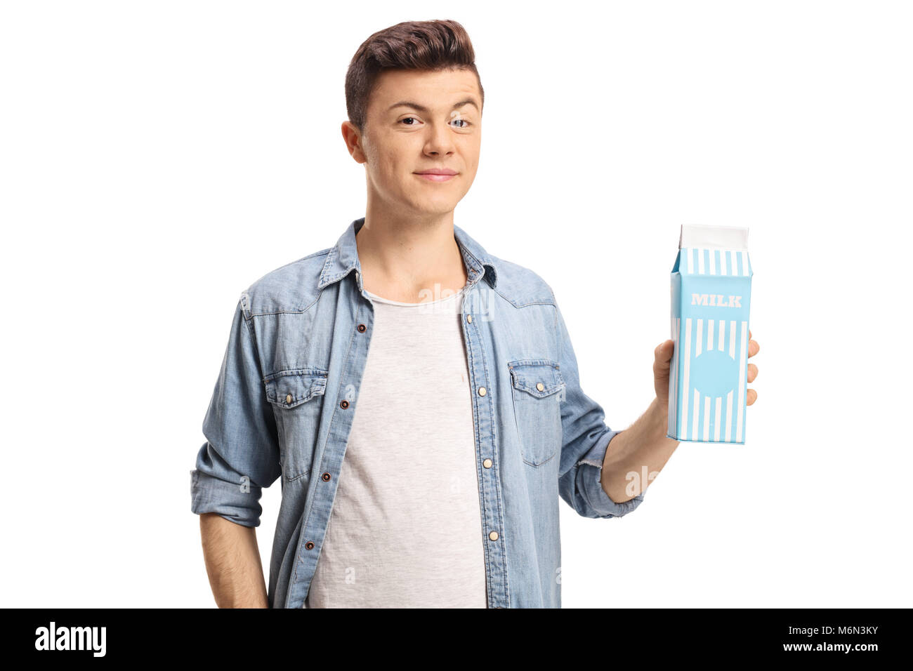 Teenage boy holding a milk carton isolated on white background Stock ...