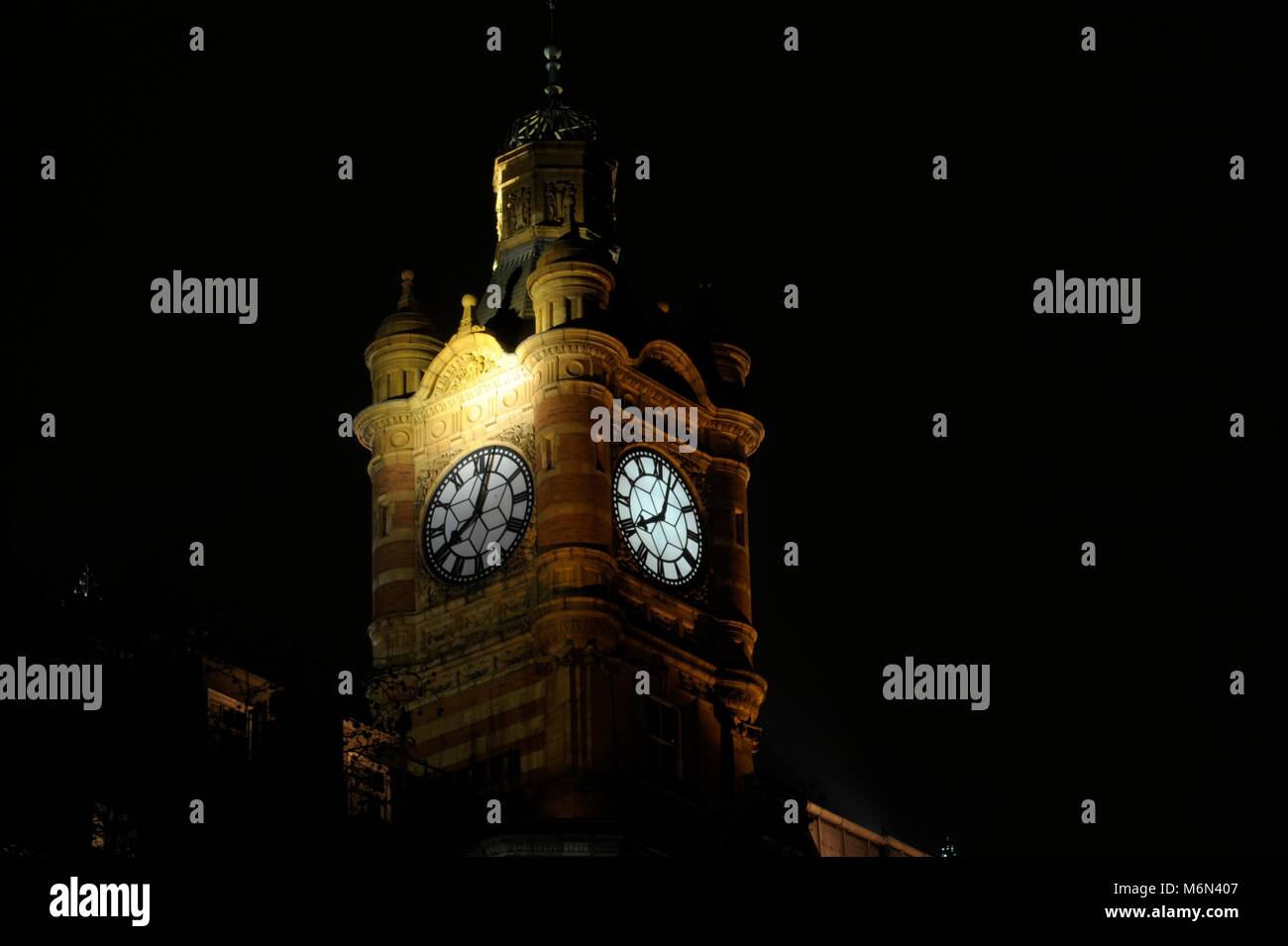 Clocks on building exterior Stock Photo - Alamy