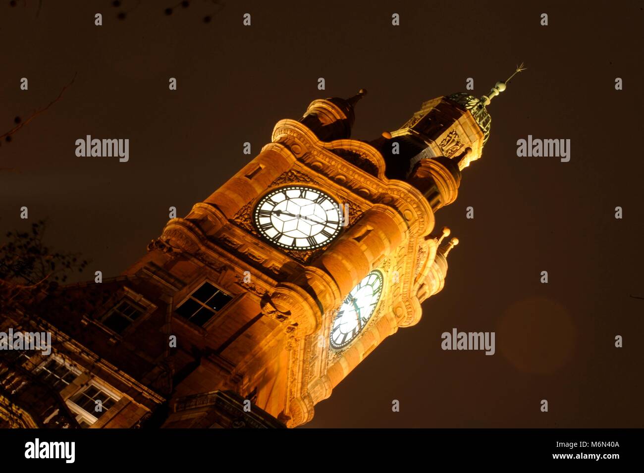 Clocks on building exterior Stock Photo - Alamy