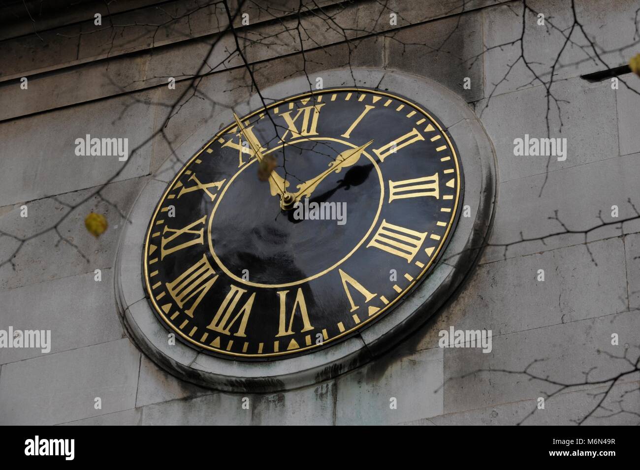 Clocks on building exterior Stock Photo - Alamy