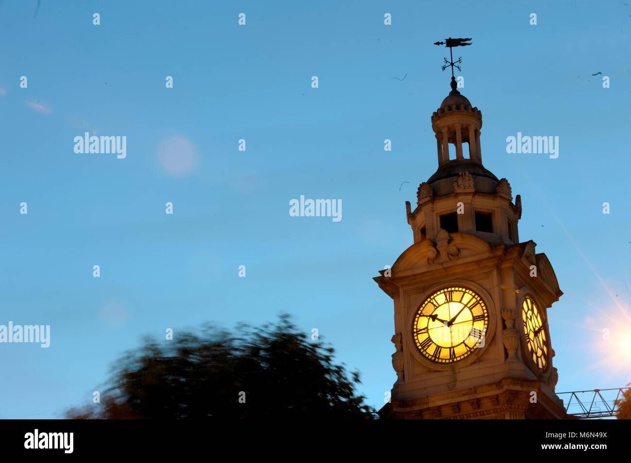 Clocks on building exterior Stock Photo - Alamy