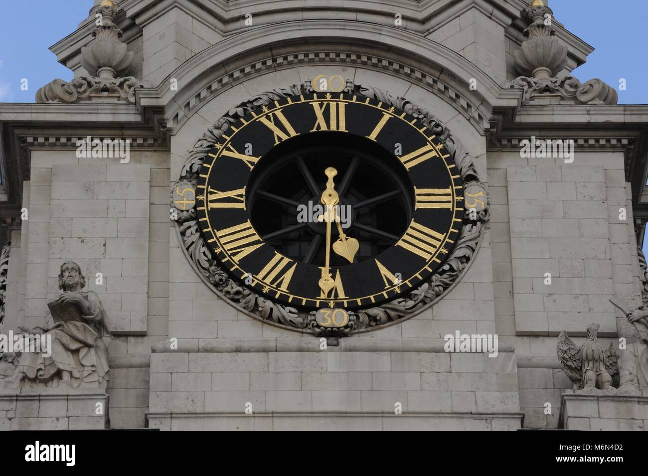 Clocks on building exterior Stock Photo - Alamy