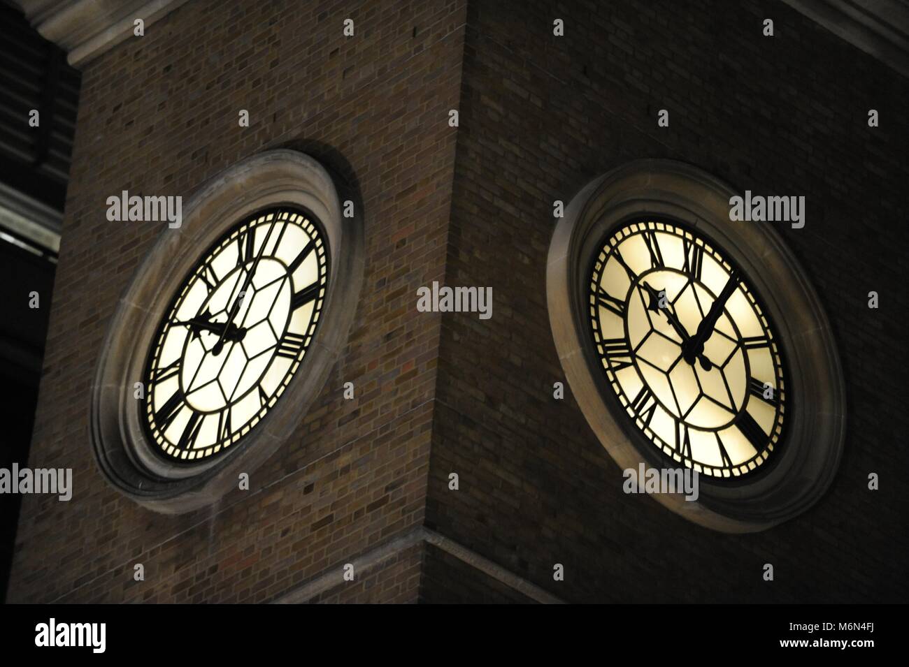 Clocks on building exterior Stock Photo - Alamy