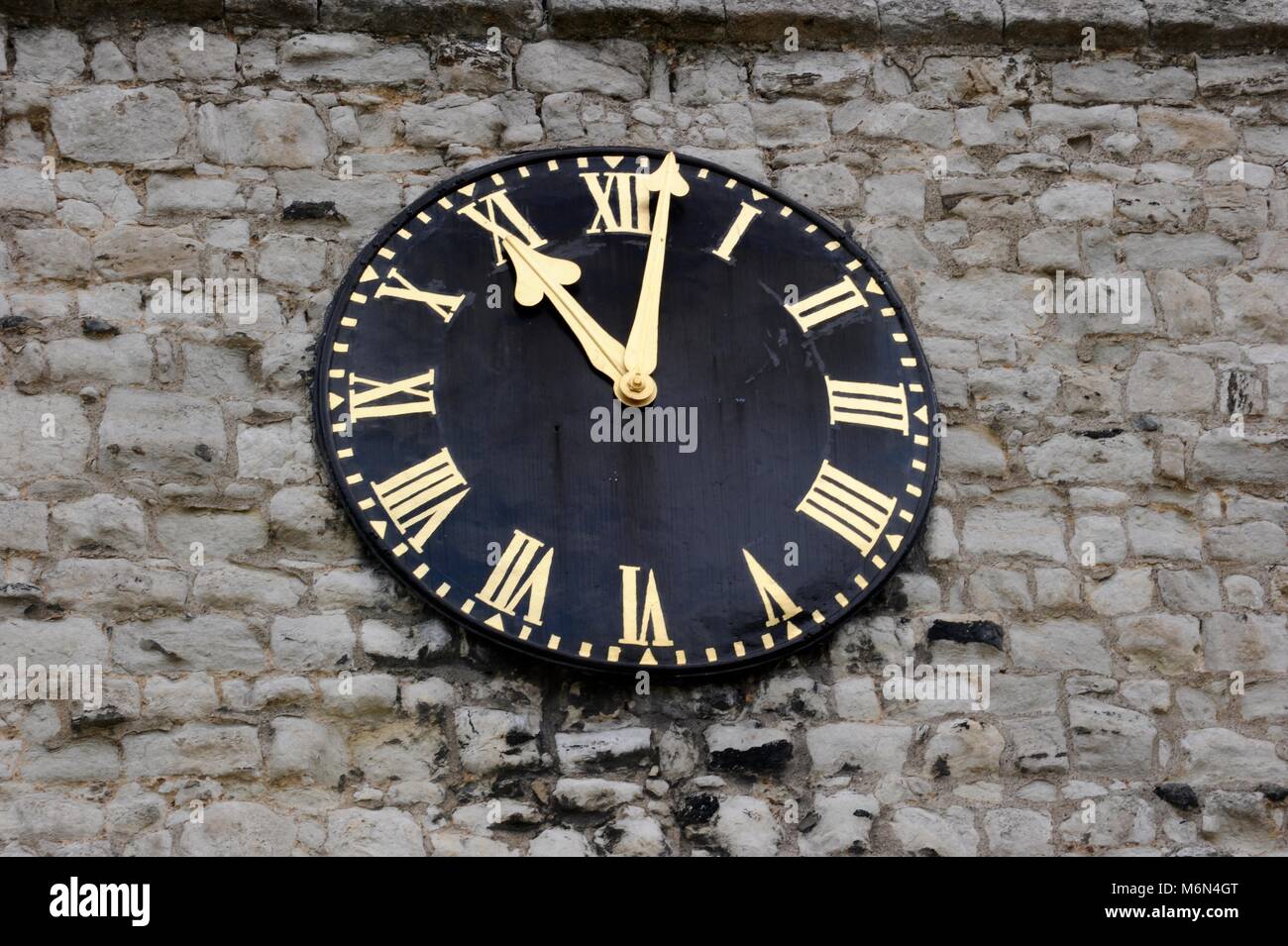 Clocks on building exterior Stock Photo - Alamy
