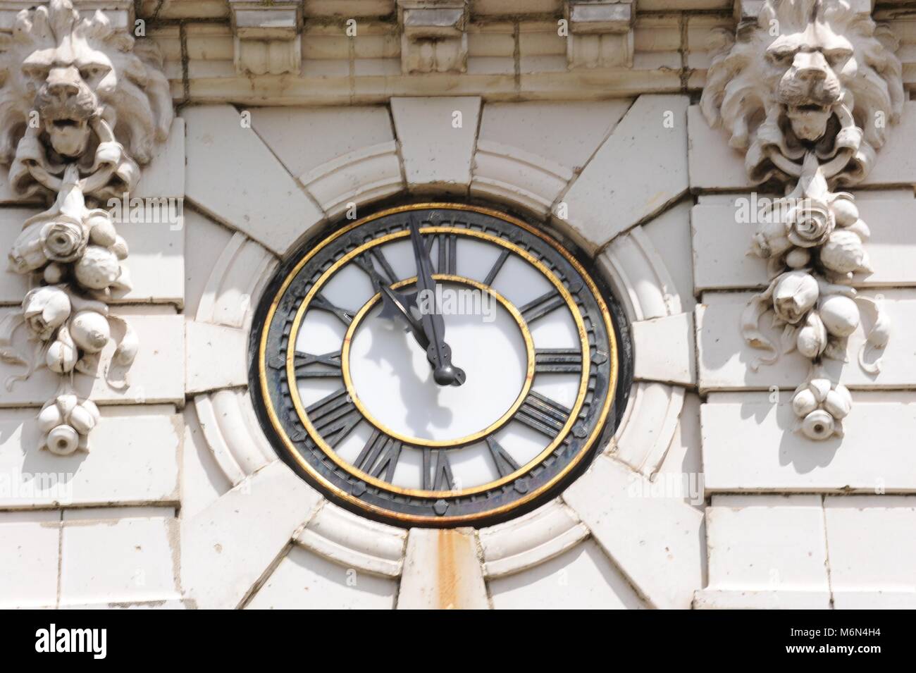 Clocks on building exterior Stock Photo - Alamy