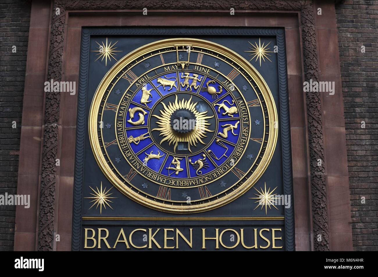 Clocks on building exterior Stock Photo - Alamy