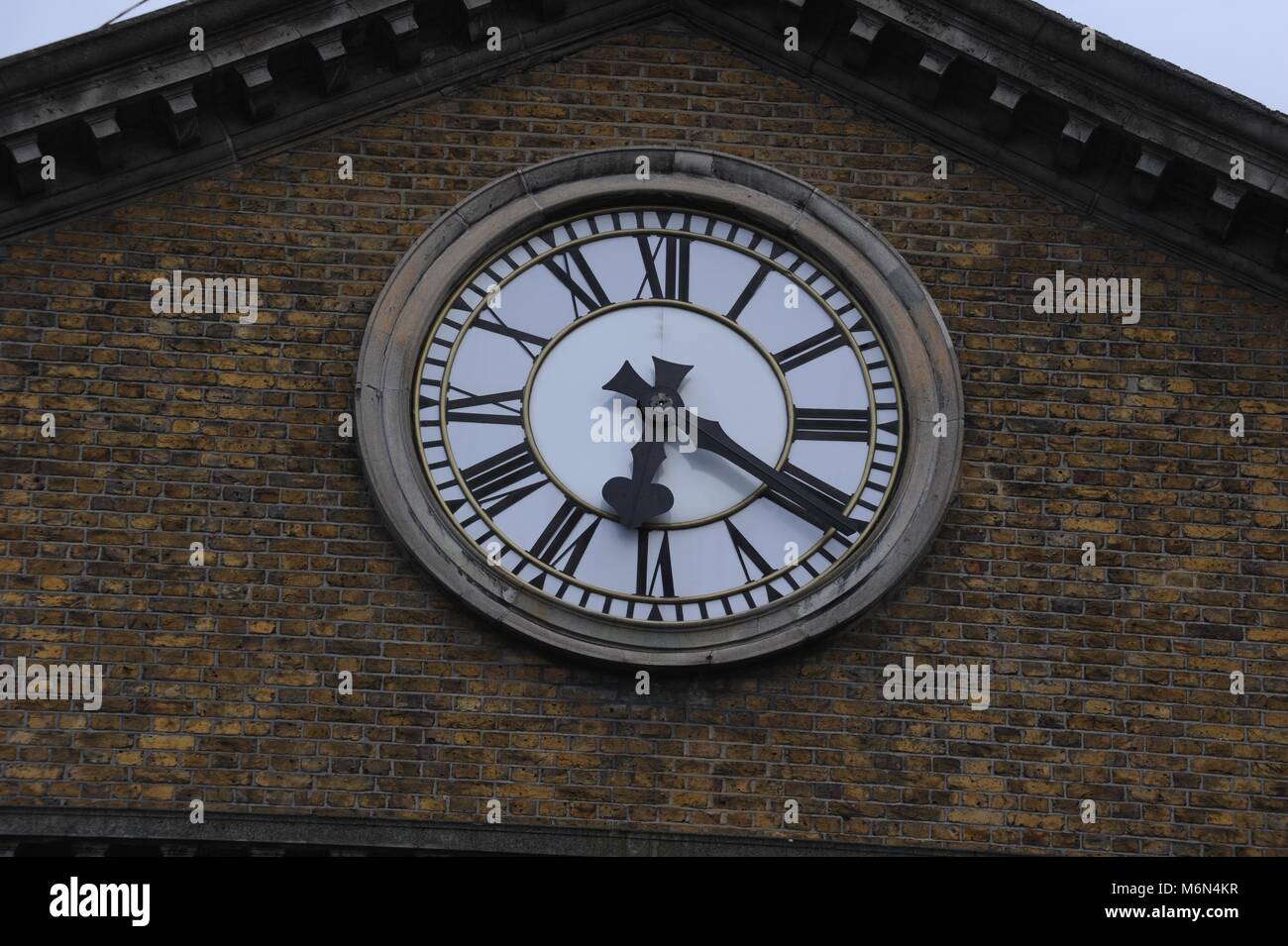 Clocks on building exterior Stock Photo - Alamy