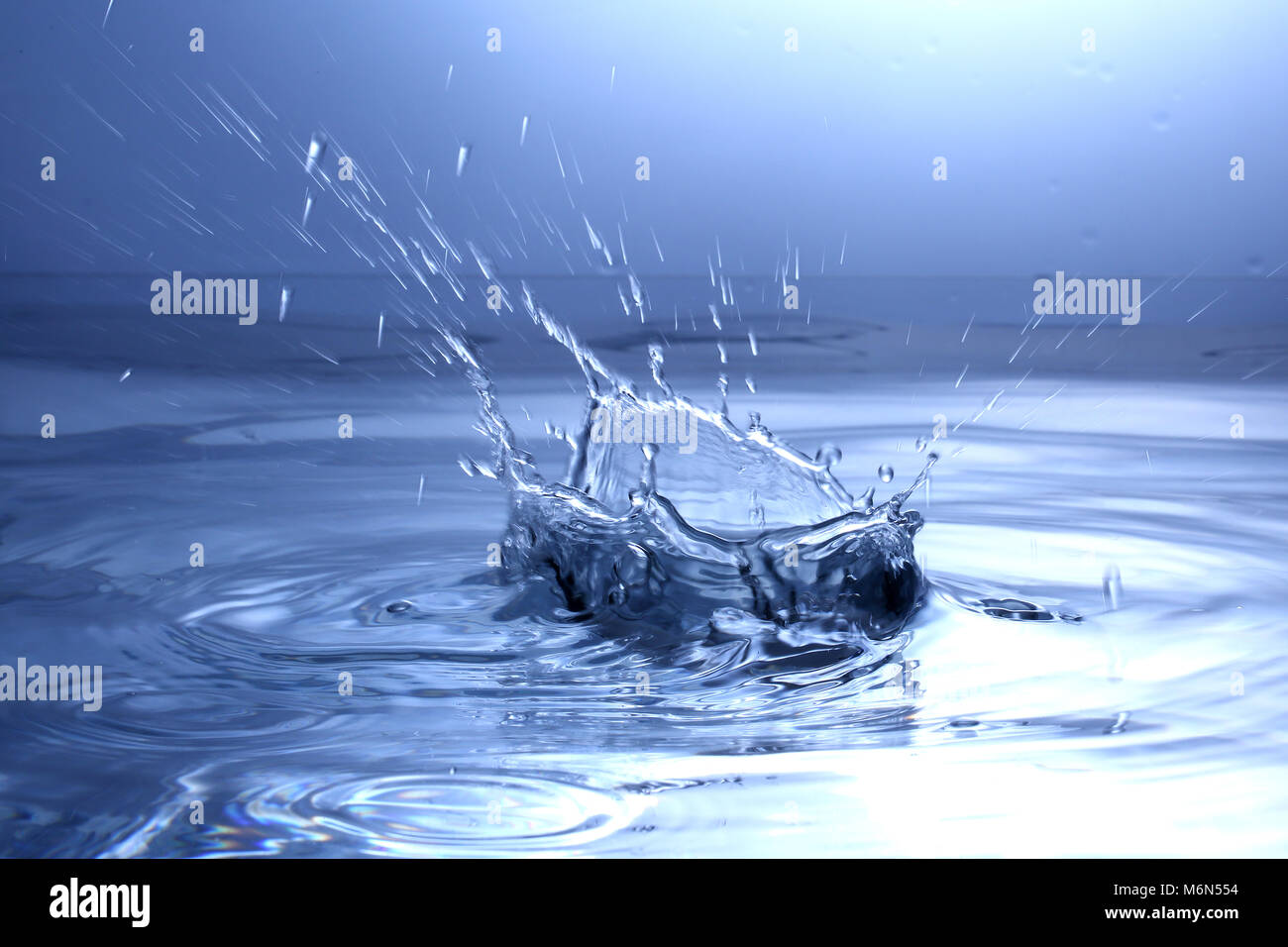 Spread, Water splash at reflective surface. 091 Stock Photo - Alamy