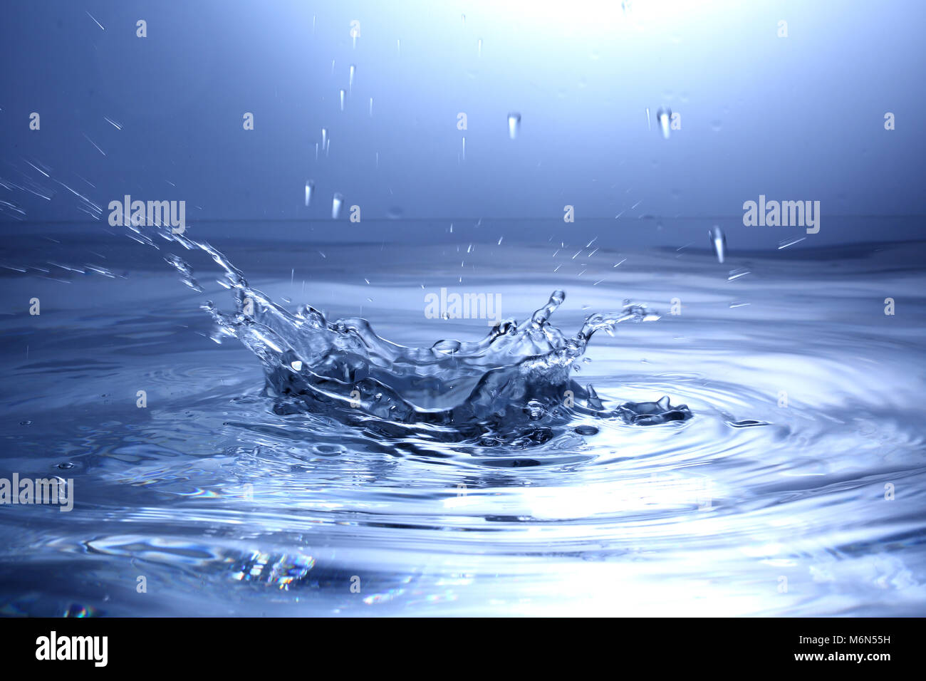 Spread, Water splash at reflective surface. 092 Stock Photo - Alamy