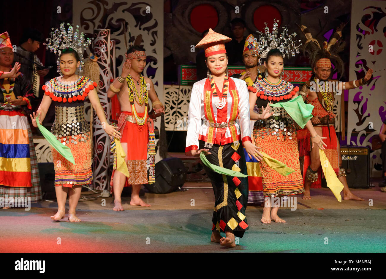 Dancers in traditional native costumes at the Sarawak Cultural Village ...