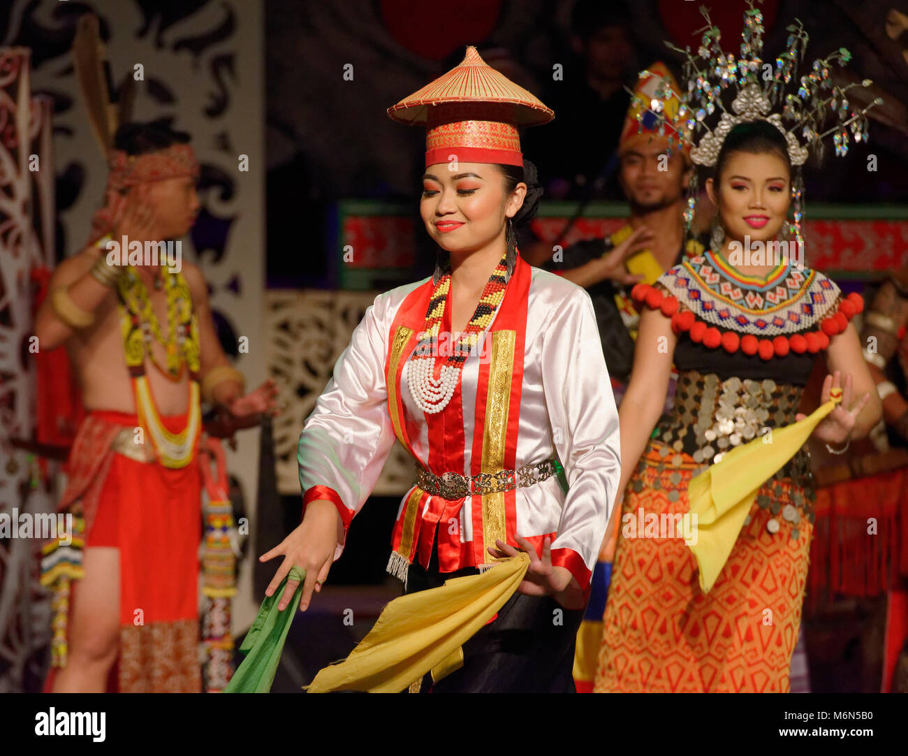Dancers in traditional native costumes at the Sarawak Cultural Village ...