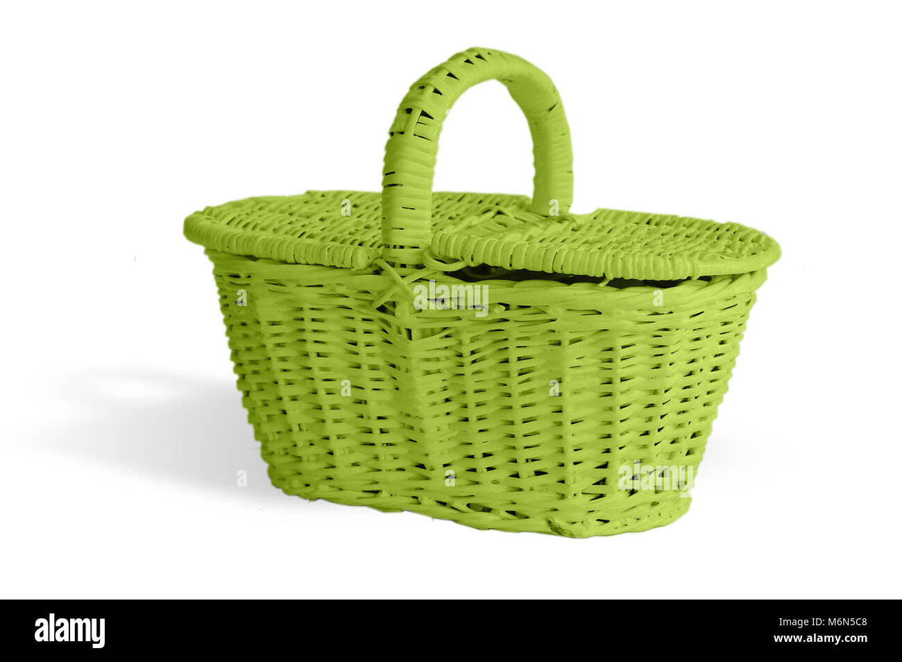 green wicker basket isolated on white background Stock Photo - Alamy