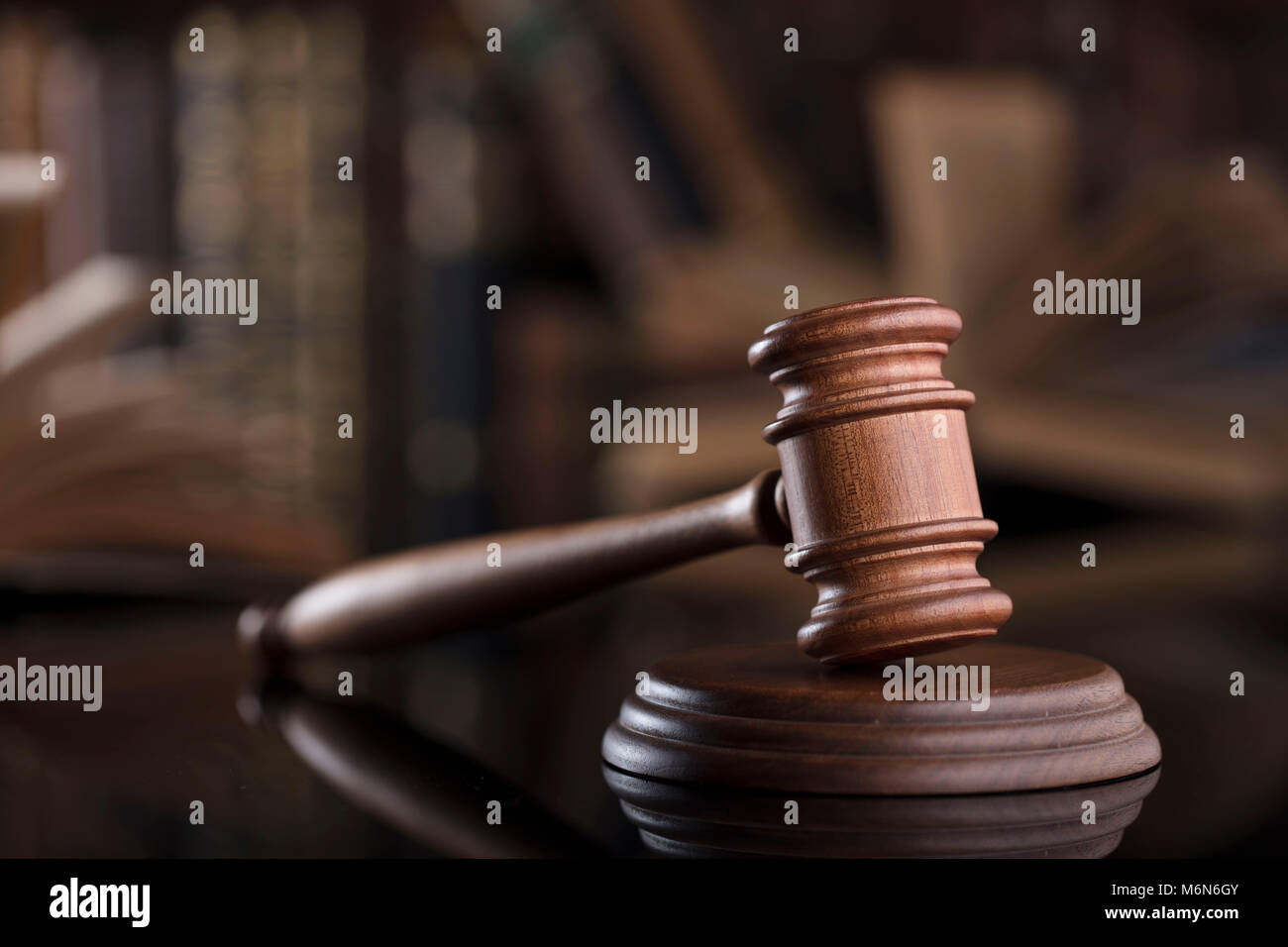 Law theme. Court library. Judge’s gavel on book background. Place for ...