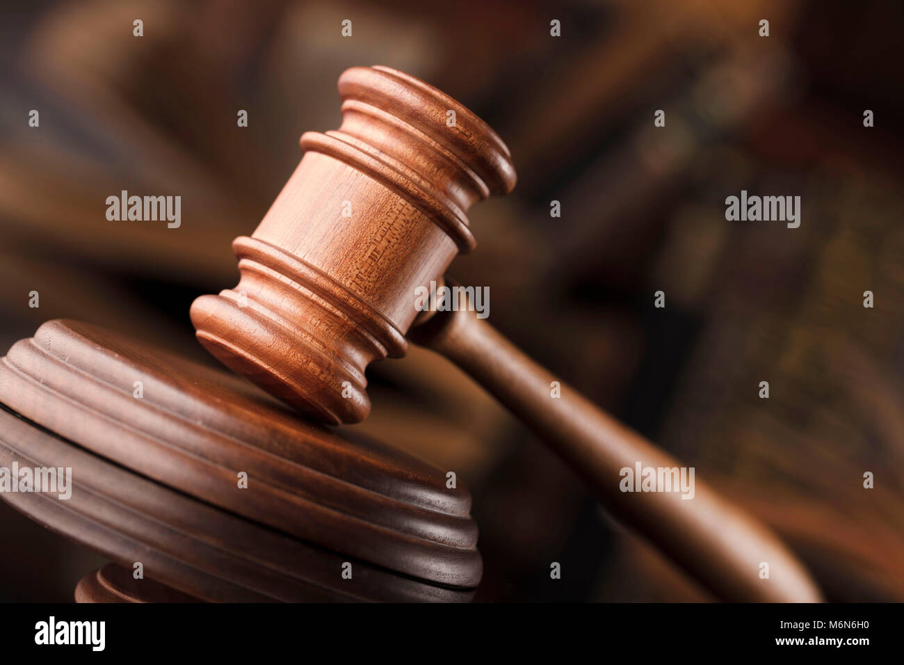 Law theme. Court library. Judge’s gavel on book background. Place for ...