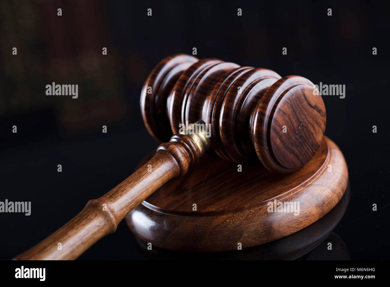 Law theme. Court library. Judge’s gavel on book background. Place for ...