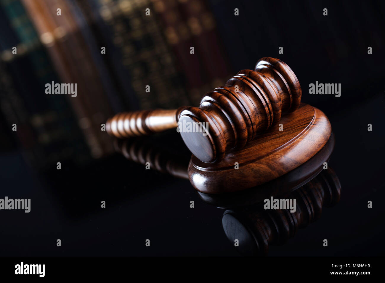 Law theme. Court library. Judge’s gavel on book background. Place for ...
