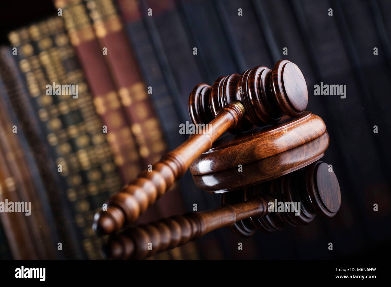 Law theme. Court library. Judge’s gavel on book background. Place for ...