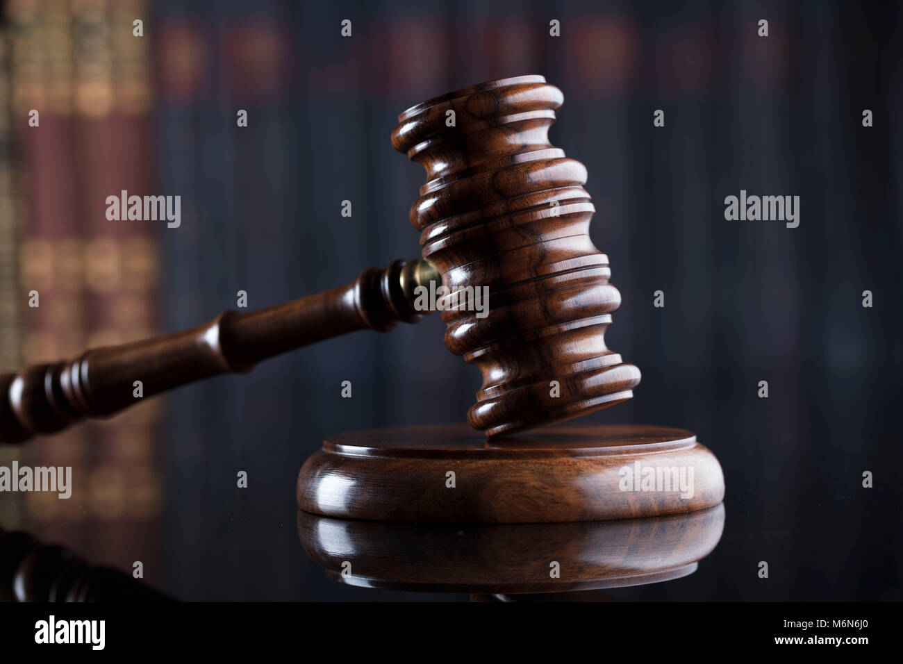 Law theme. Court library. Judge’s gavel on book background. Place for ...