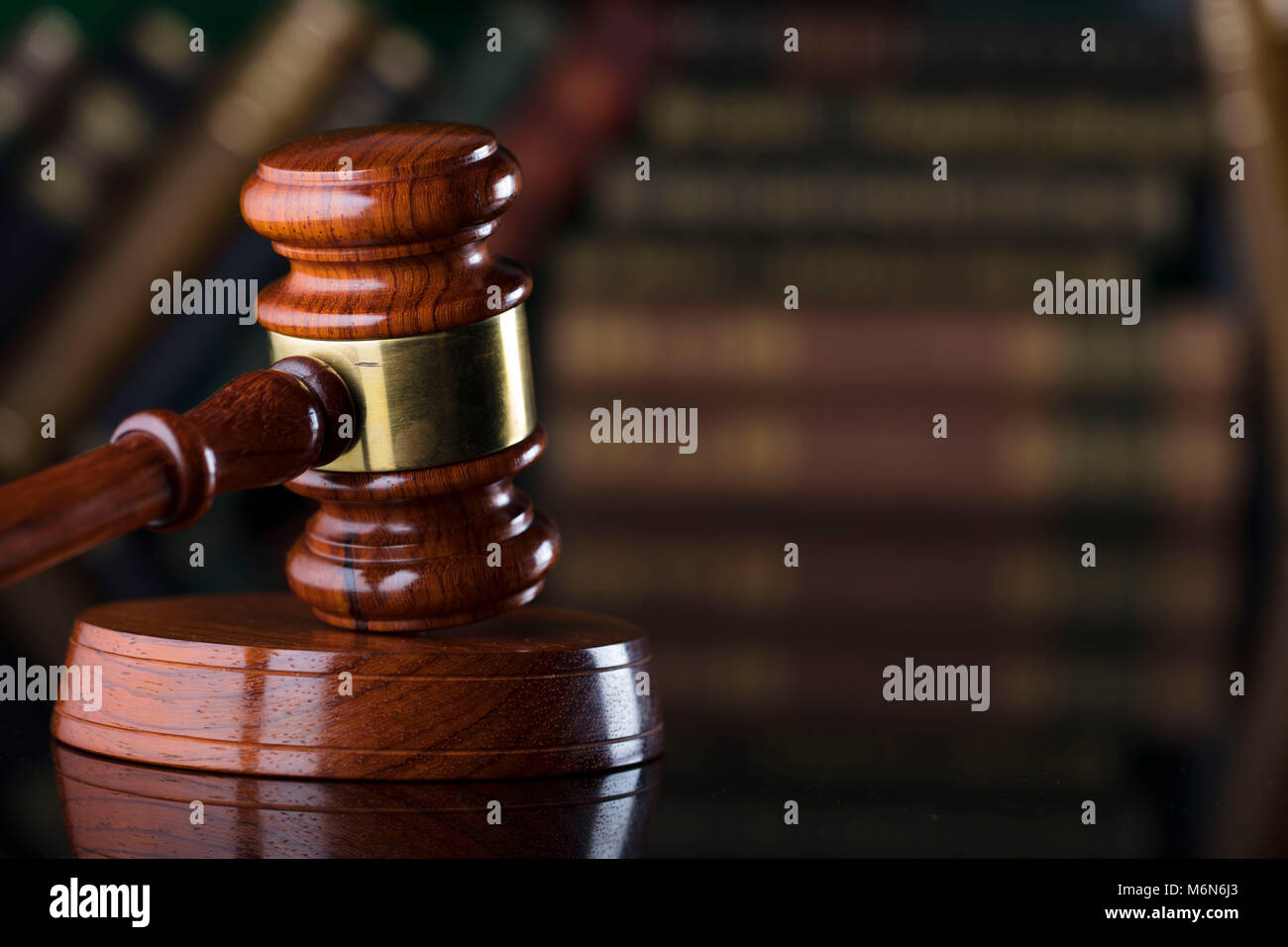 Law theme. Court library. Judge’s gavel on book background. Place for ...