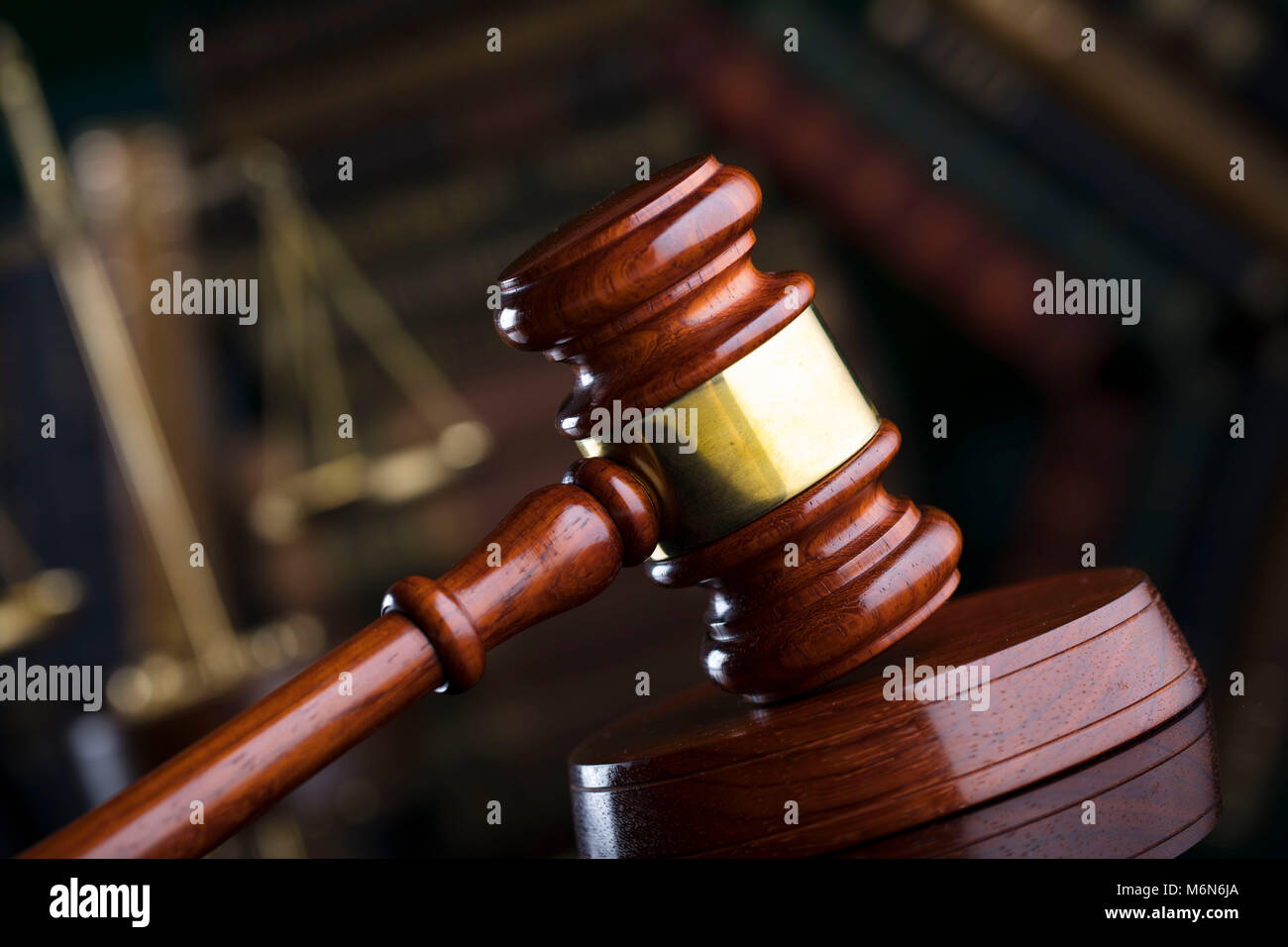 Law theme. Court library. Judge’s gavel on book background. Place for ...