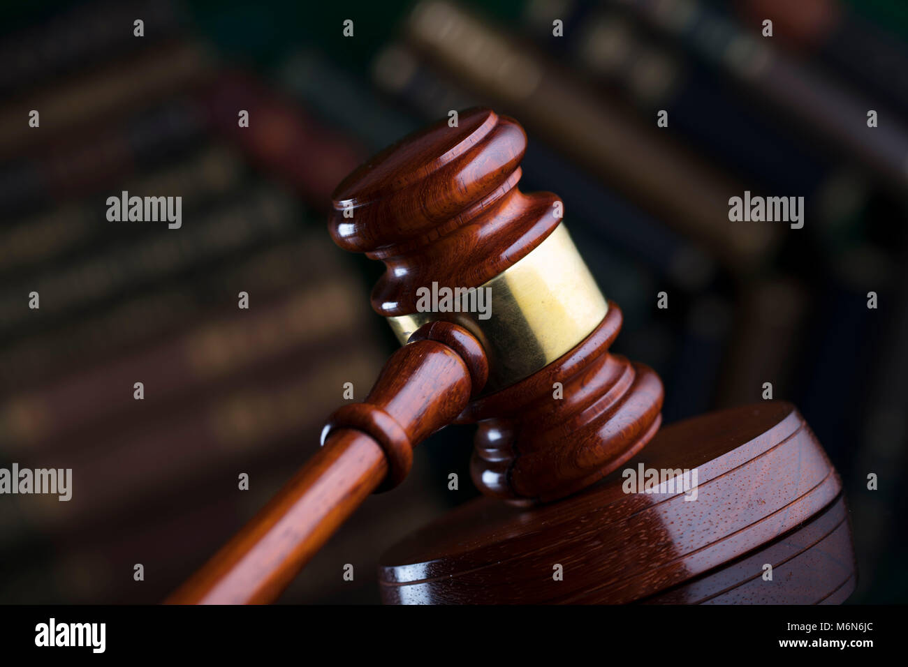 Law theme. Court library. Judge’s gavel on book background. Place for ...