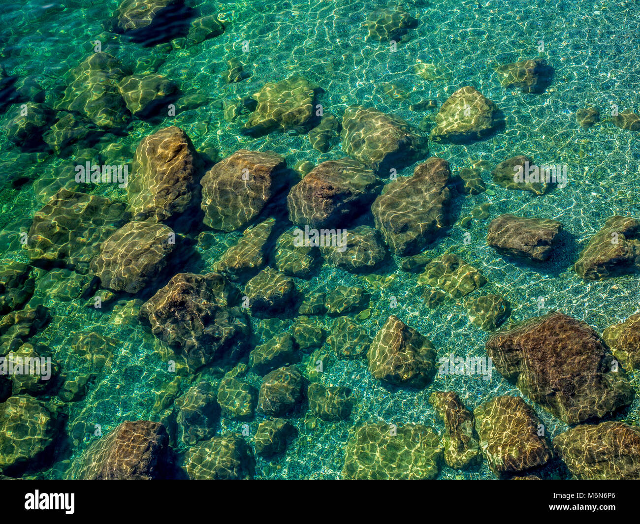 Rocks under seawater Stock Photo - Alamy