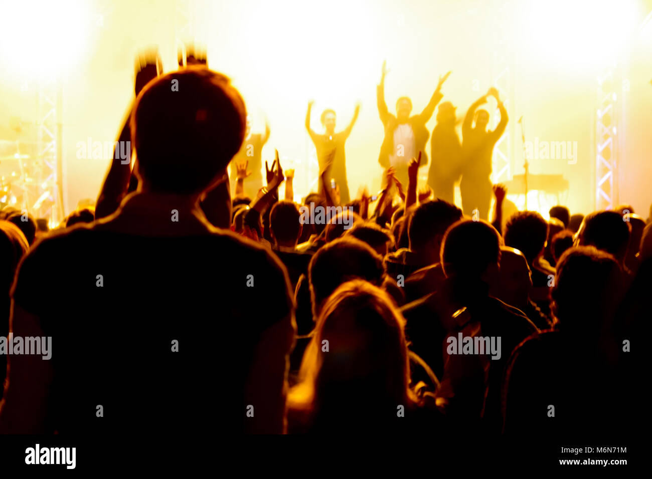 Audience at a show, from the back, with ligths from the stage Stock ...