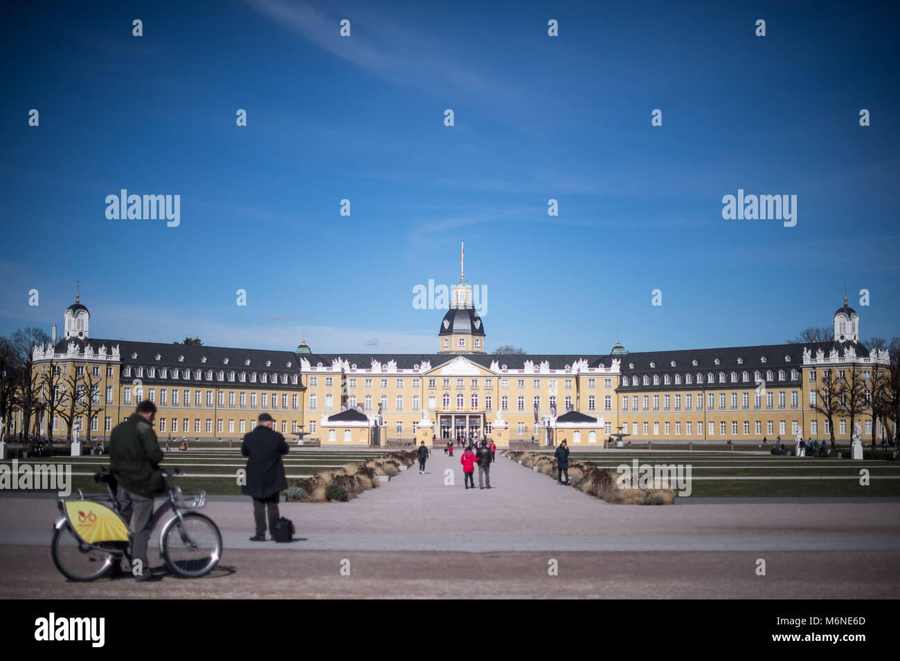 Pedestrians stand in front hi-res stock photography and images - Alamy