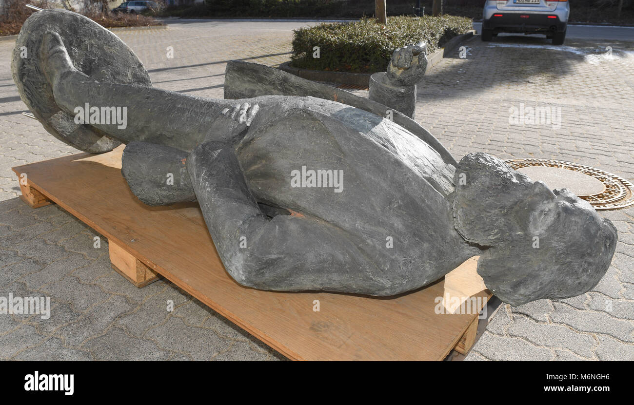 23 February 2018, Germany, Neubrandenburg: The Karl Marx statue lies on ...