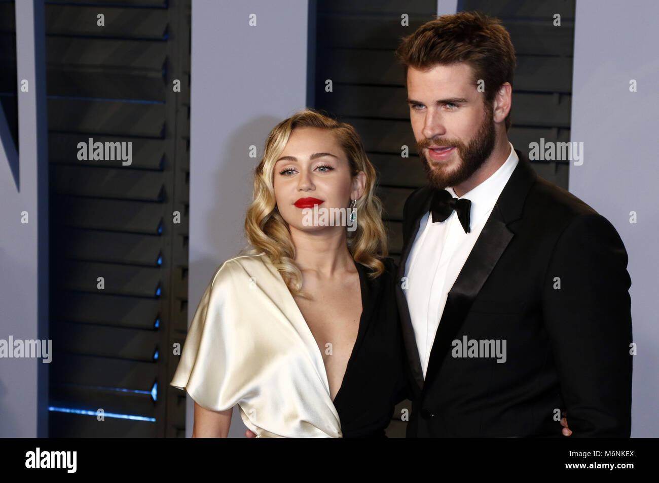 Miley Cyrus and Liam Hemsworth attending the 2018 Vanity Fair Oscar ...