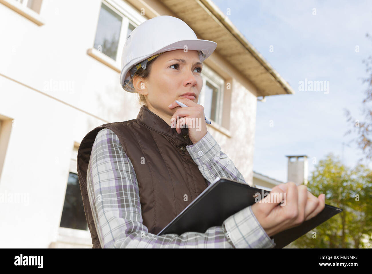 thoughtful female health and safety inspector Stock Photo - Alamy