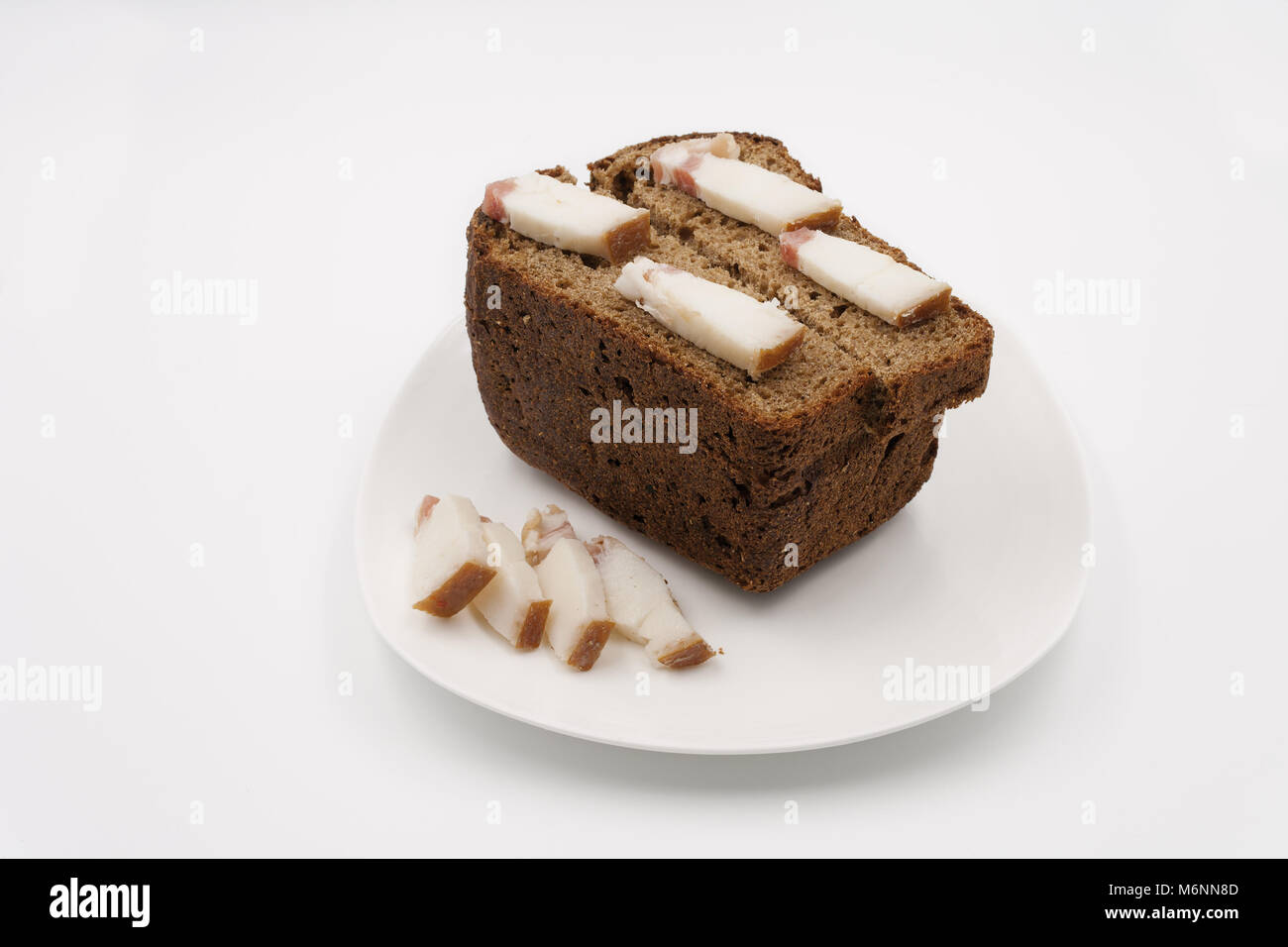 Rye bread and slices of fat. On a white background Stock Photo - Alamy